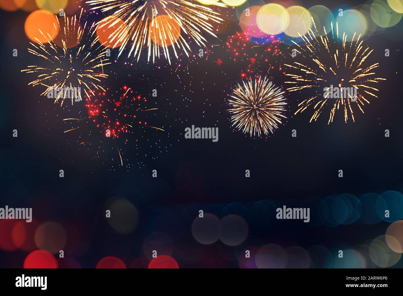 Abstract color fireworks display on dark sky background with copy space ...