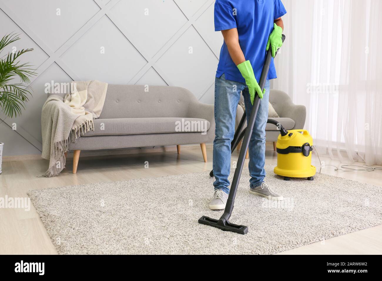 Man hoovering room hi-res stock photography and images - Alamy