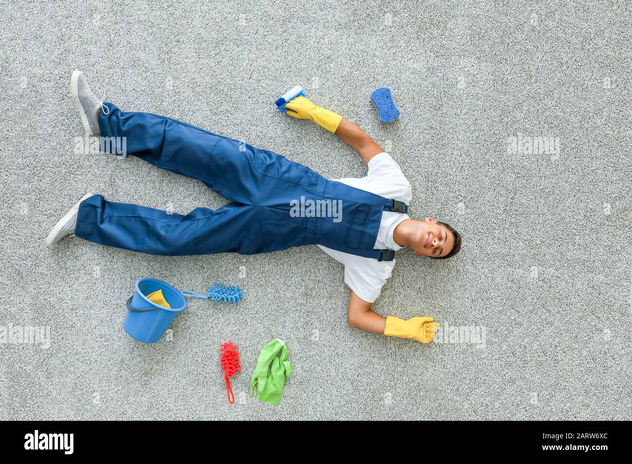 Tired young man lying hi-res stock photography and images - Alamy