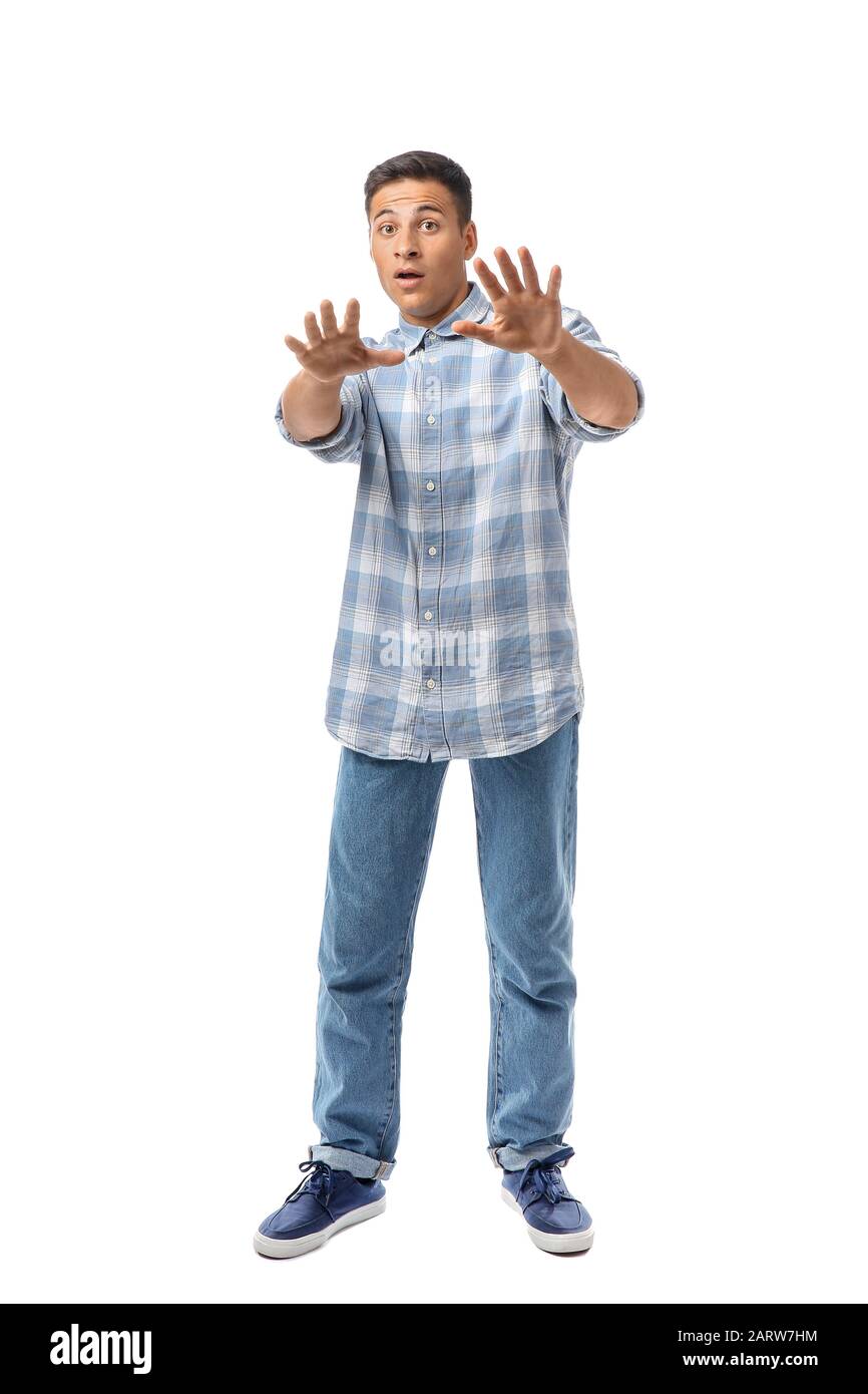 Portrait of scared young man on white background Stock Photo - Alamy