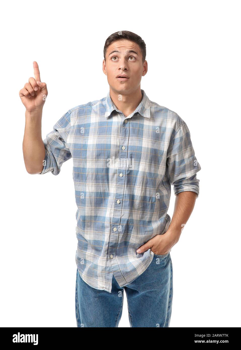 Portrait of handsome young man with raised index finger on white ...
