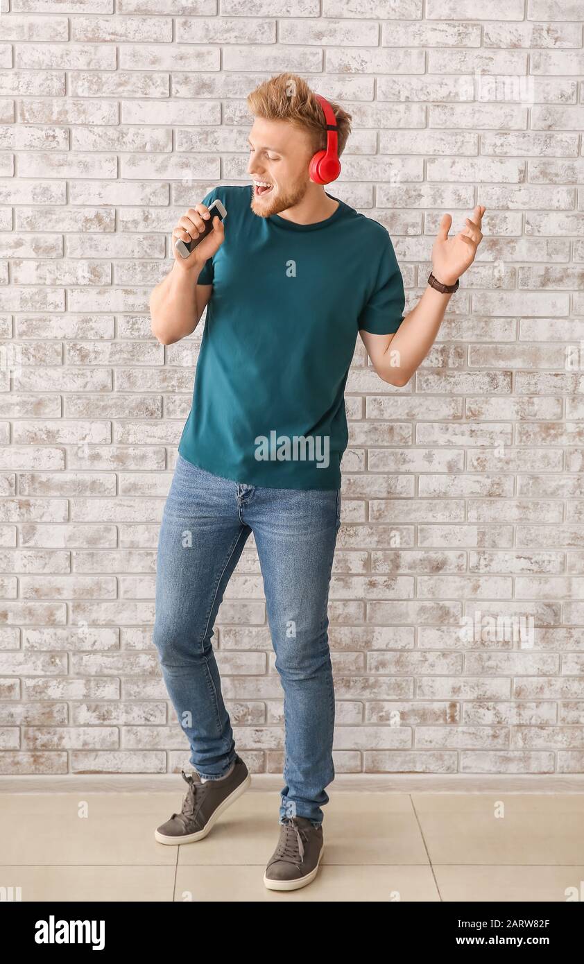 Guy dancing singing listening music hi-res stock photography and images ...