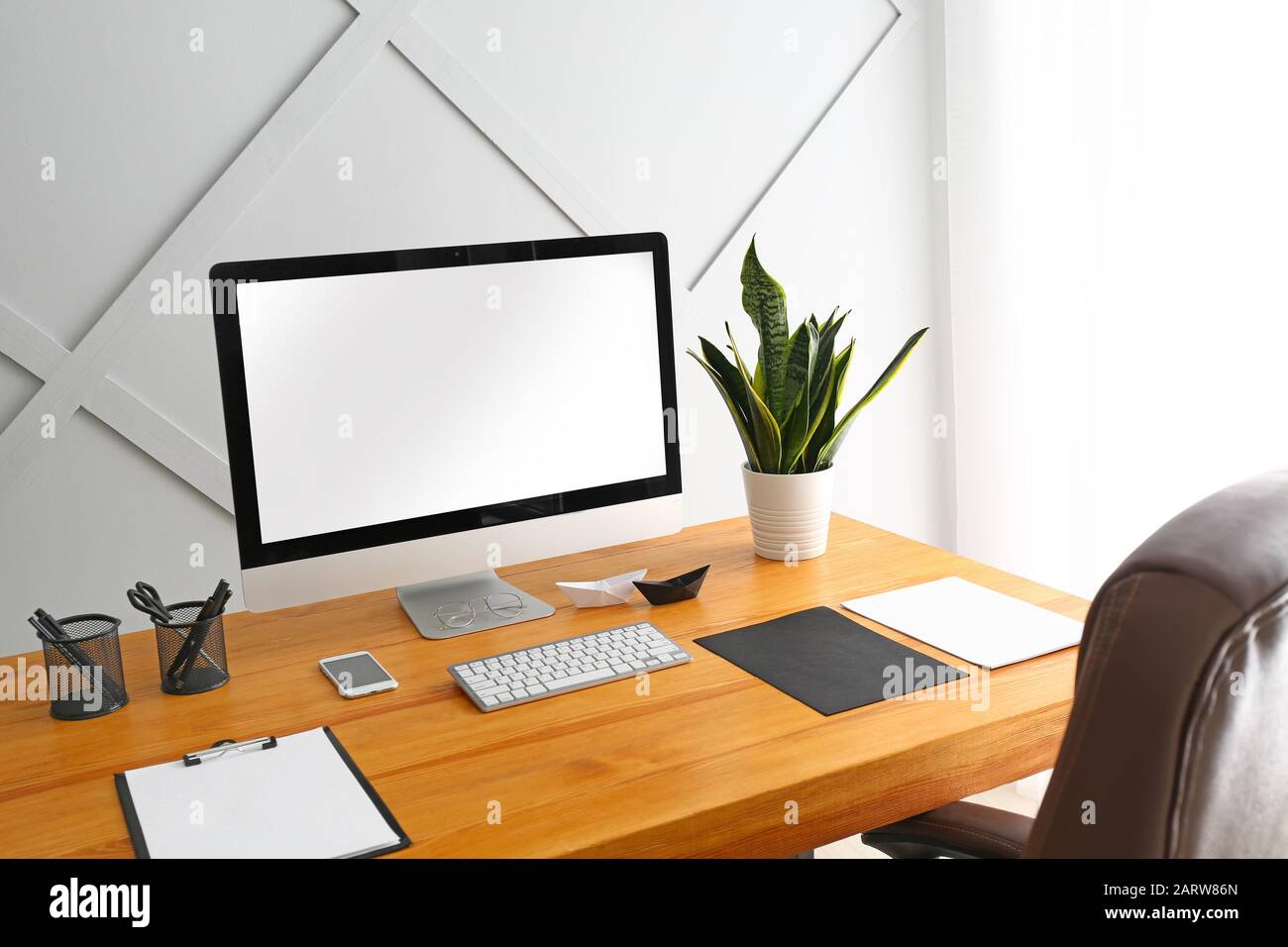 Modern workplace with computer in office Stock Photo - Alamy