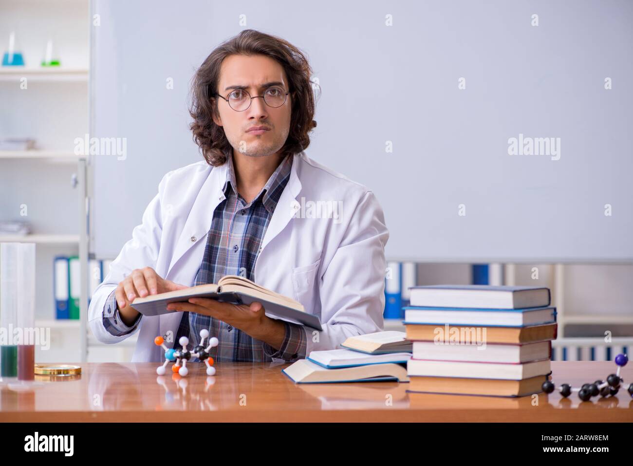 The chemistry lecturer during lecture in college Stock Photo - Alamy