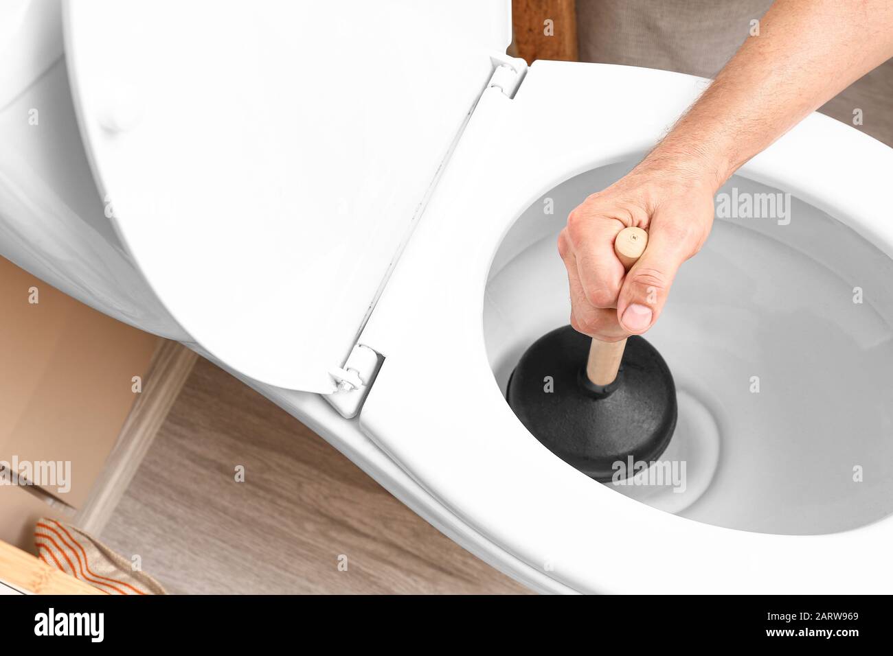 Man using toilet hi-res stock photography and images - Alamy