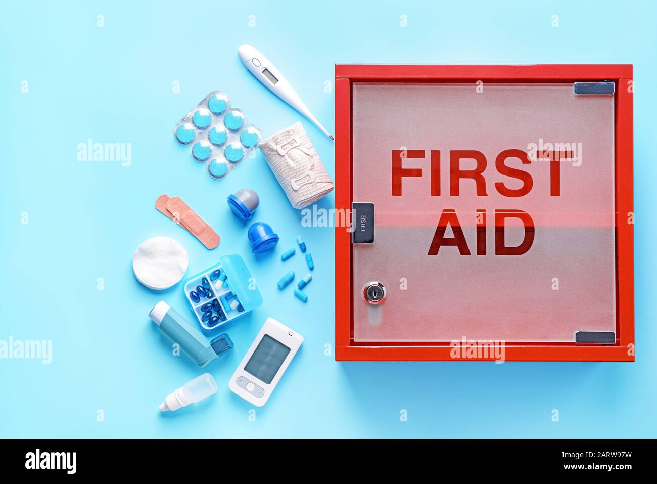 First aid kit on color background Stock Photo - Alamy