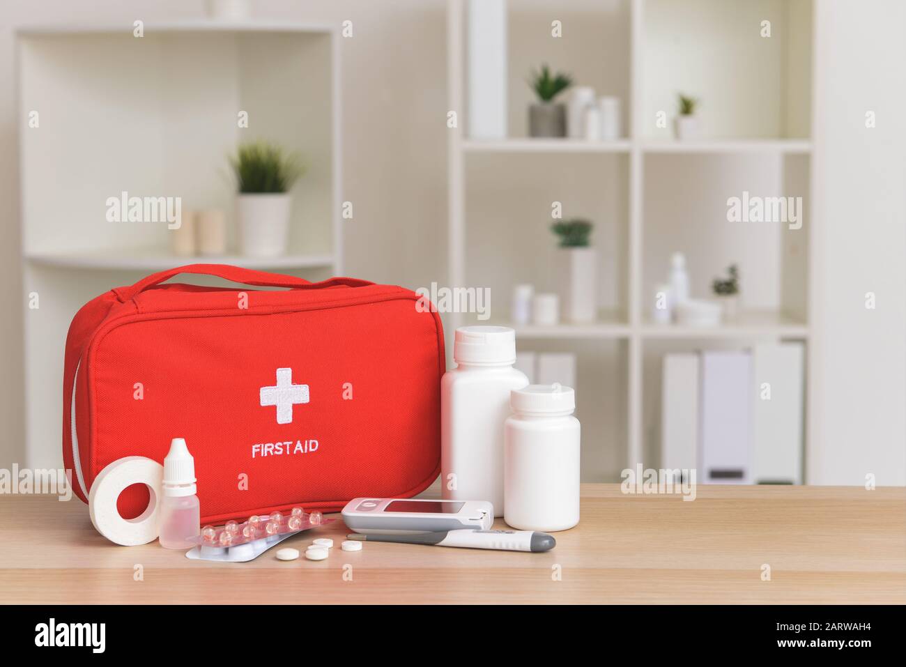 First aid kit on table in clinic Stock Photo - Alamy