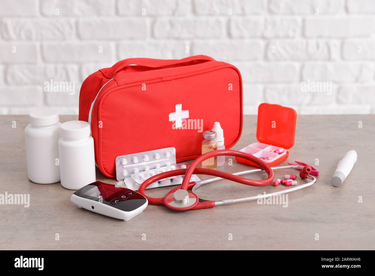 First aid kit on table Stock Photo - Alamy