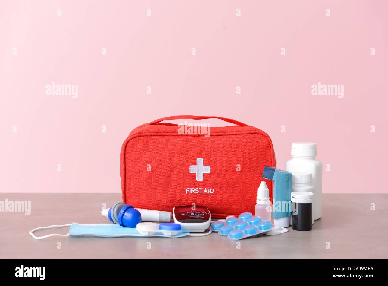 First aid kit on table Stock Photo - Alamy