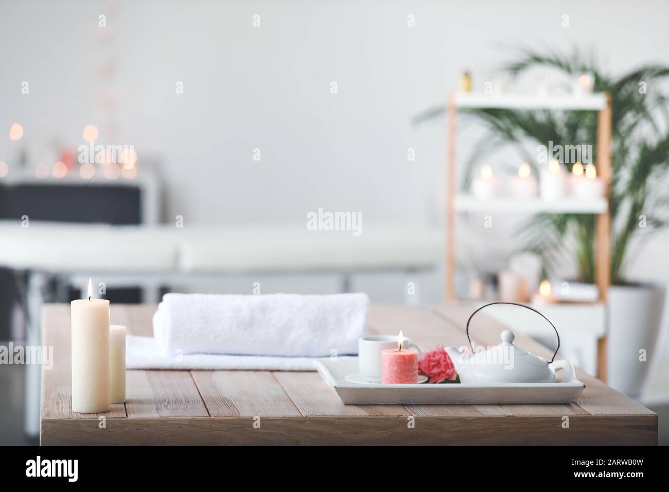 Teapot and spa items on table in salon Stock Photo - Alamy
