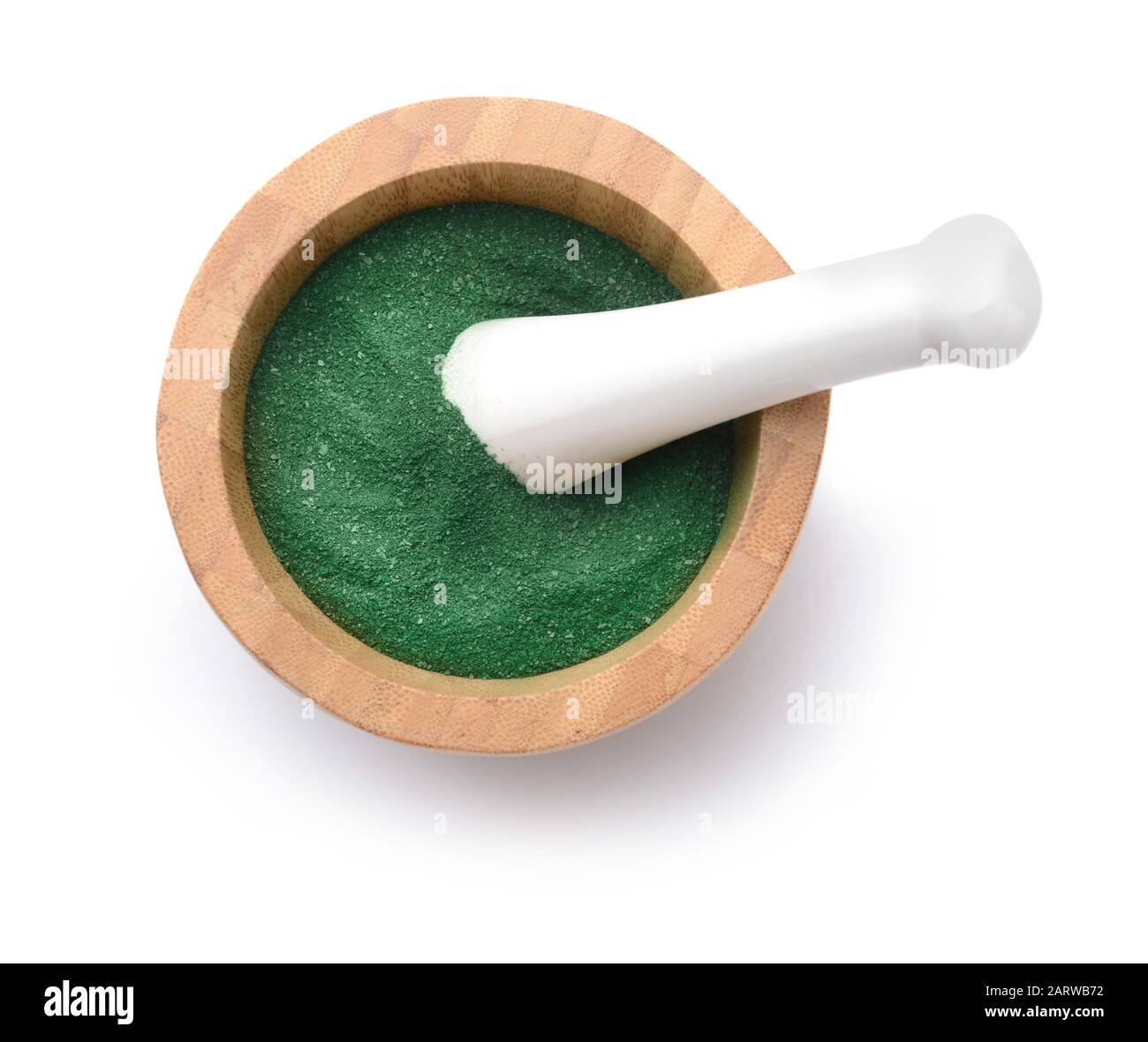 Mortar with spirulina powder and pestle on white background Stock Photo ...