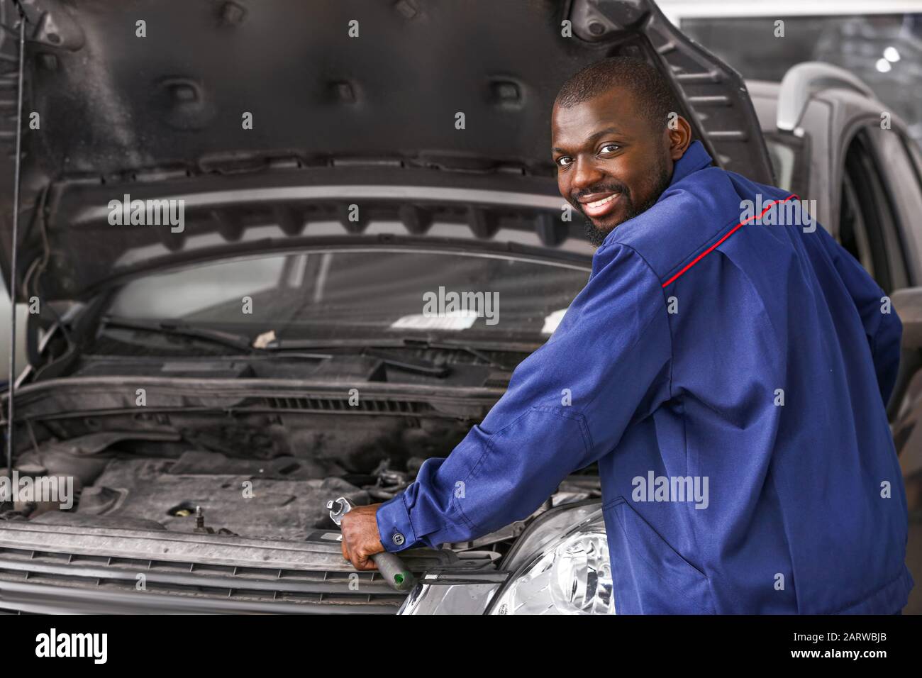 Handsome young african american mechanic hi-res stock photography and ...