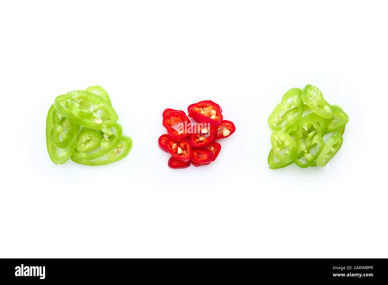 Different cut chili pepper on white background Stock Photo - Alamy