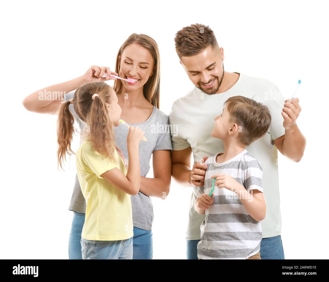 Portrait of family brushing teeth on white background Stock Photo - Alamy