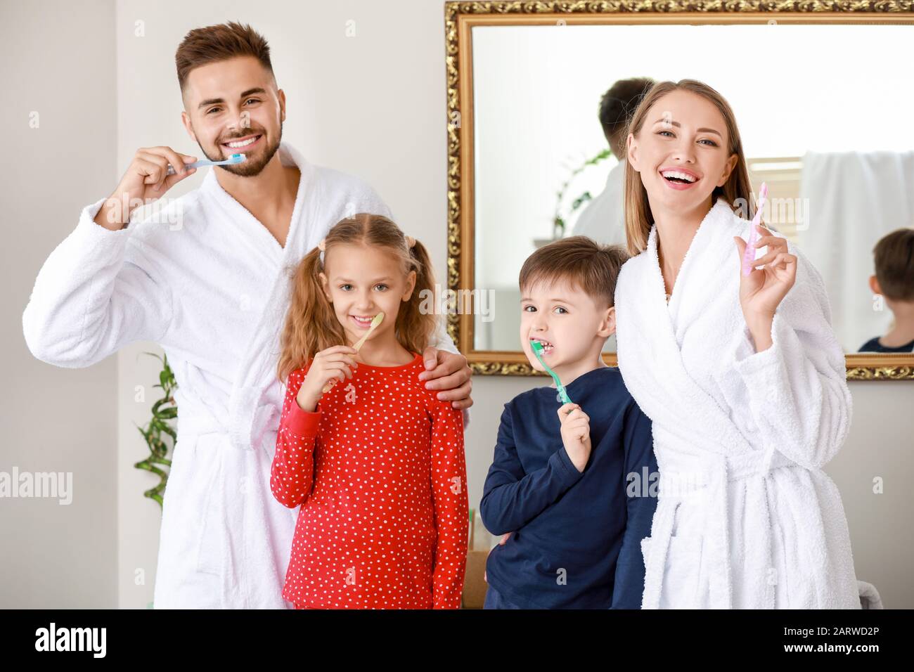 Family brushing teeth in bathroom Stock Photo - Alamy