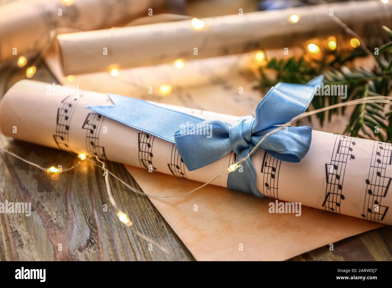 Christmas composition with music notes on wooden table Stock Photo - Alamy