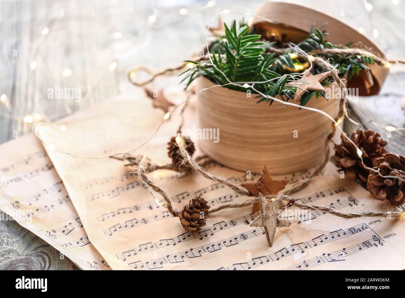 Christmas composition with music notes and box on table Stock Photo - Alamy