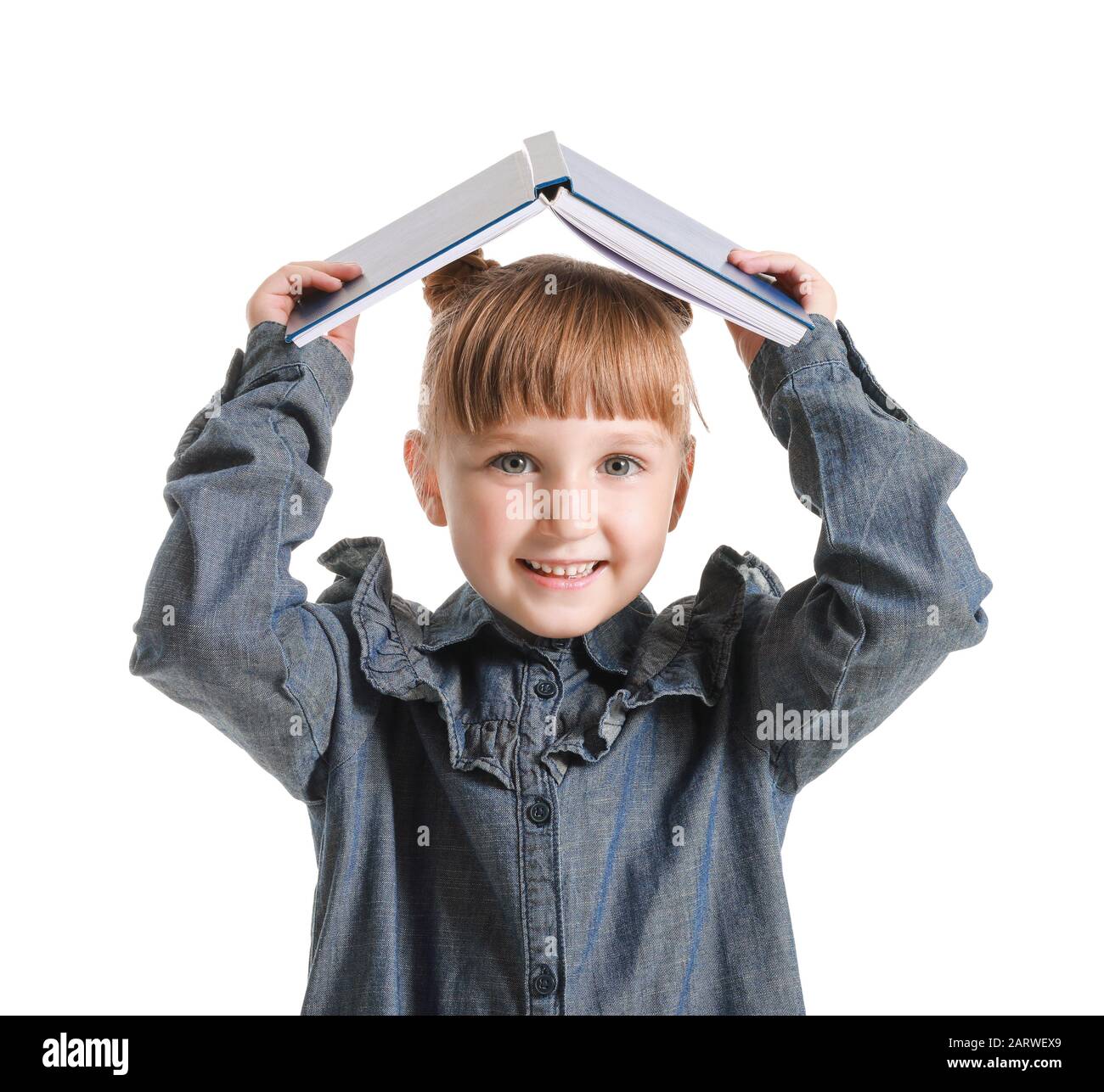 Cute little girl with book on white background Stock Photo - Alamy