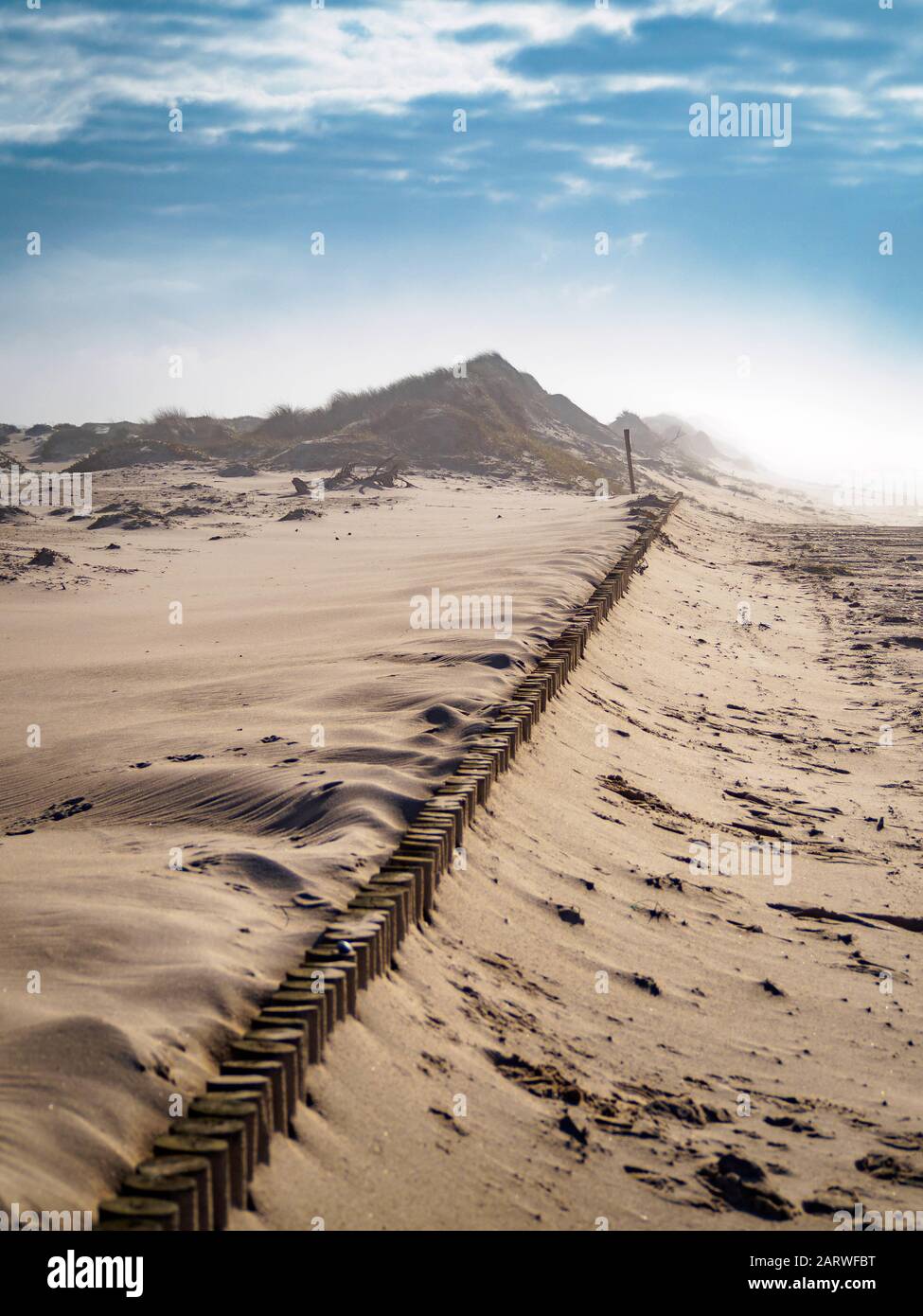 Vertical high angle shot of the sandy ground under the bright cloudy ...