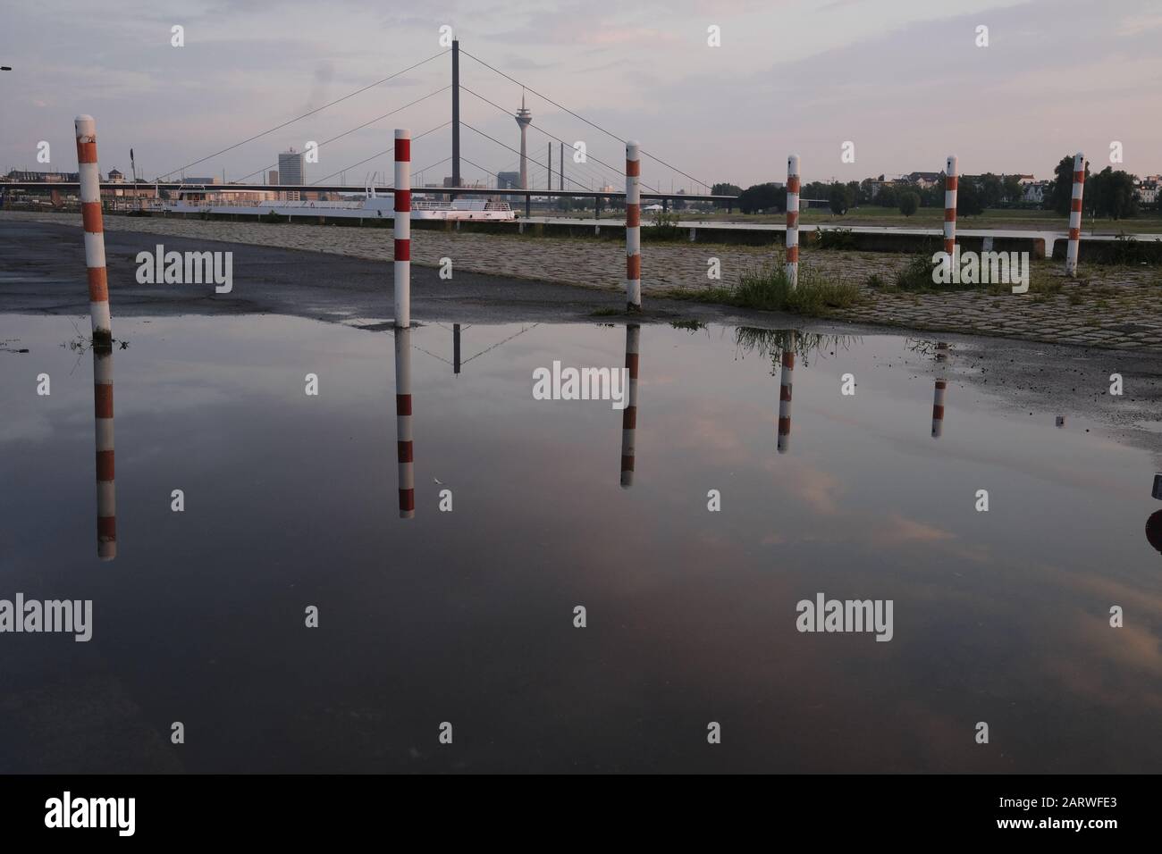 Scenery of concrete stick barriers reflecting in the lake in Dusseldorf ...