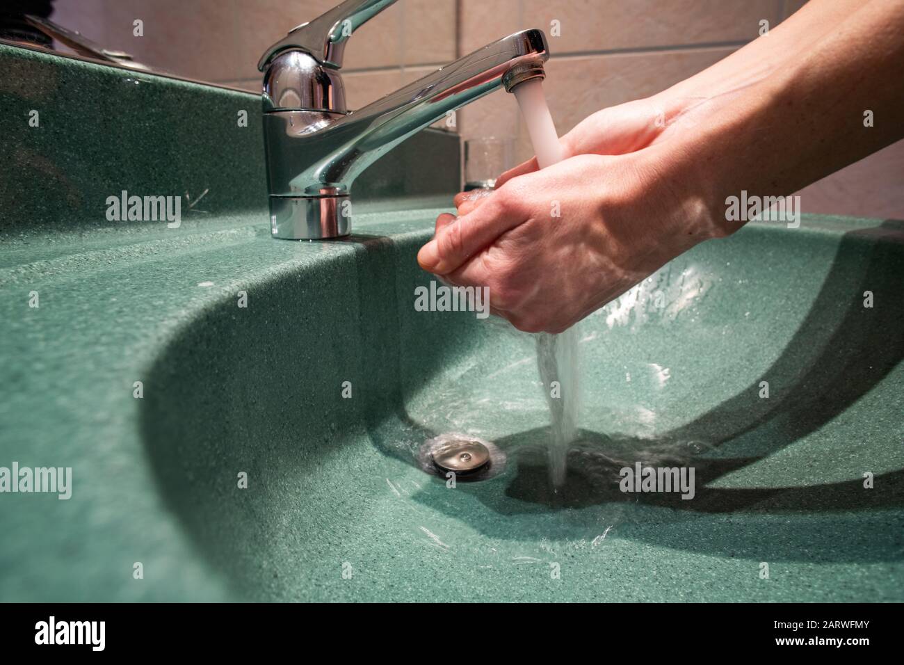 Running the tap hi-res stock photography and images - Alamy