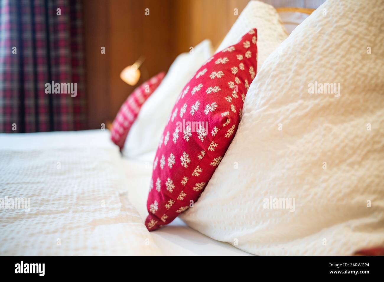 cozy bedroom red pillows hygge Stock Photo - Alamy