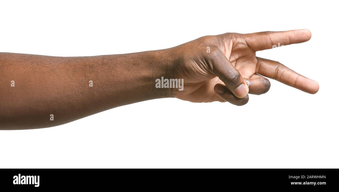 Hand of African-American man showing victory gesture on white ...