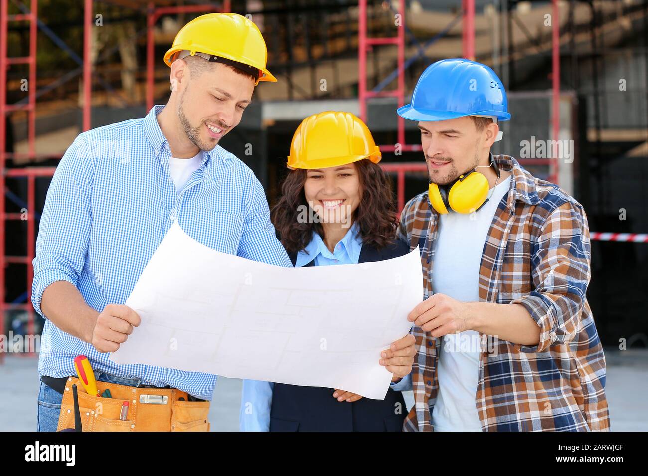 Architects discussing project of building outdoors Stock Photo - Alamy