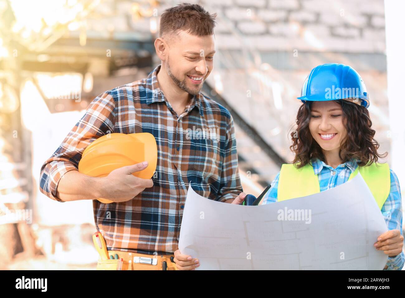 Architects discussing project of building outdoors Stock Photo - Alamy