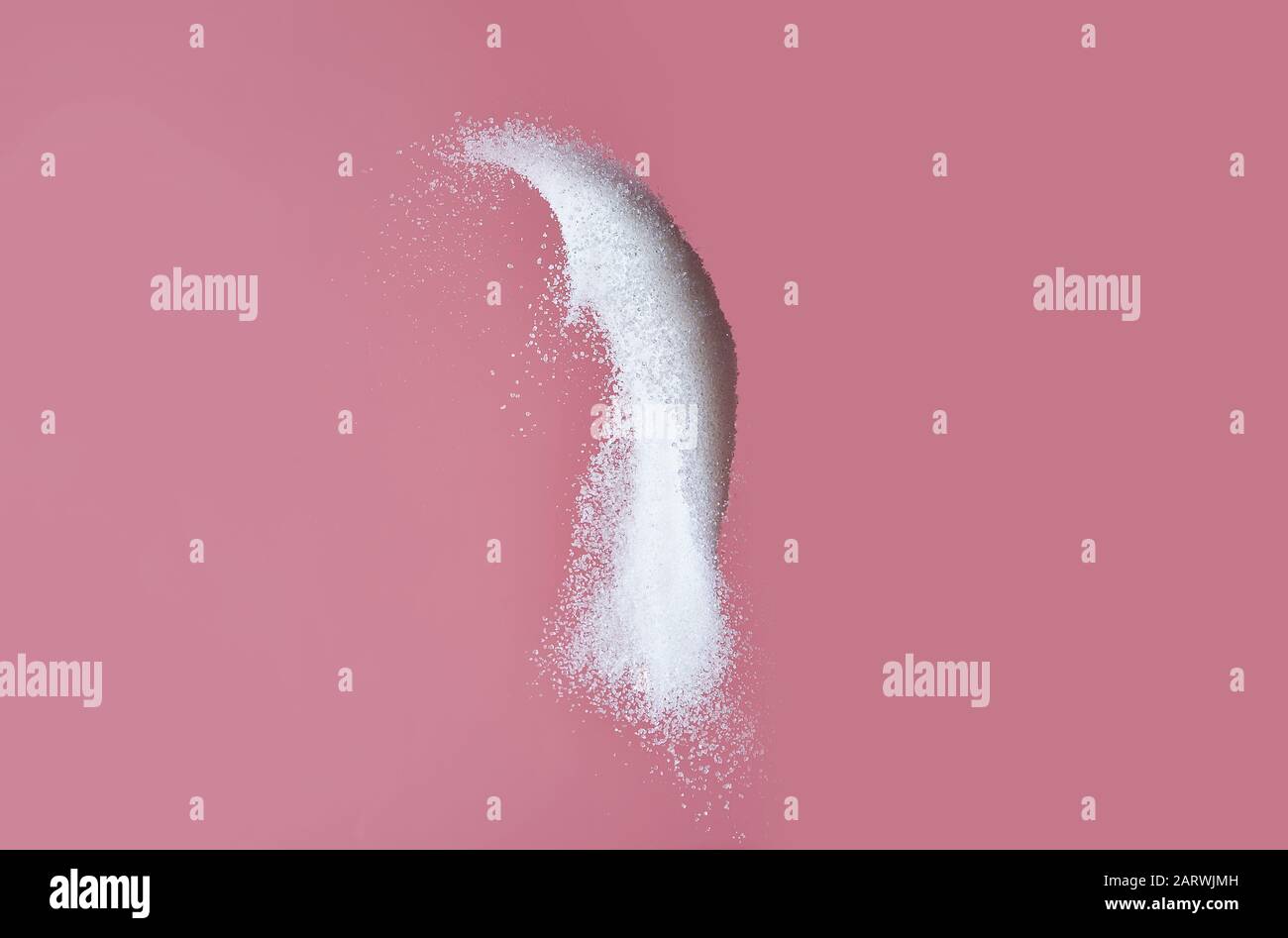 Throwing of sand sugar against color background Stock Photo - Alamy