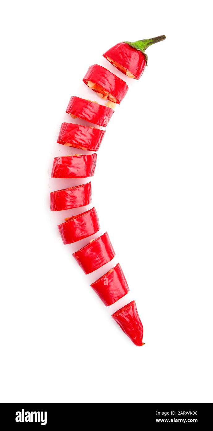 Cut chili pepper on white background Stock Photo - Alamy