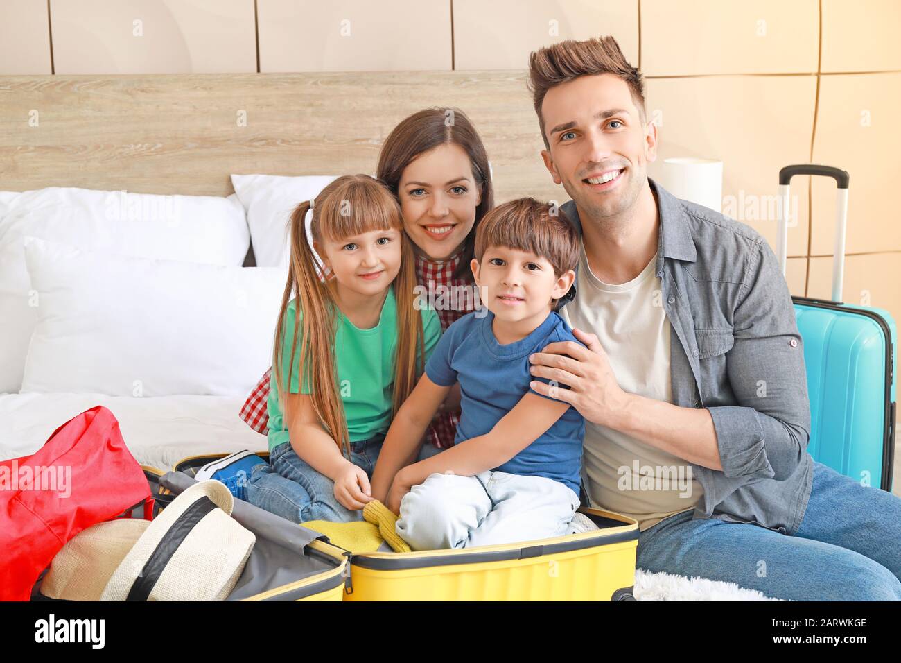 Mother son packing suitcase hi-res stock photography and images - Alamy