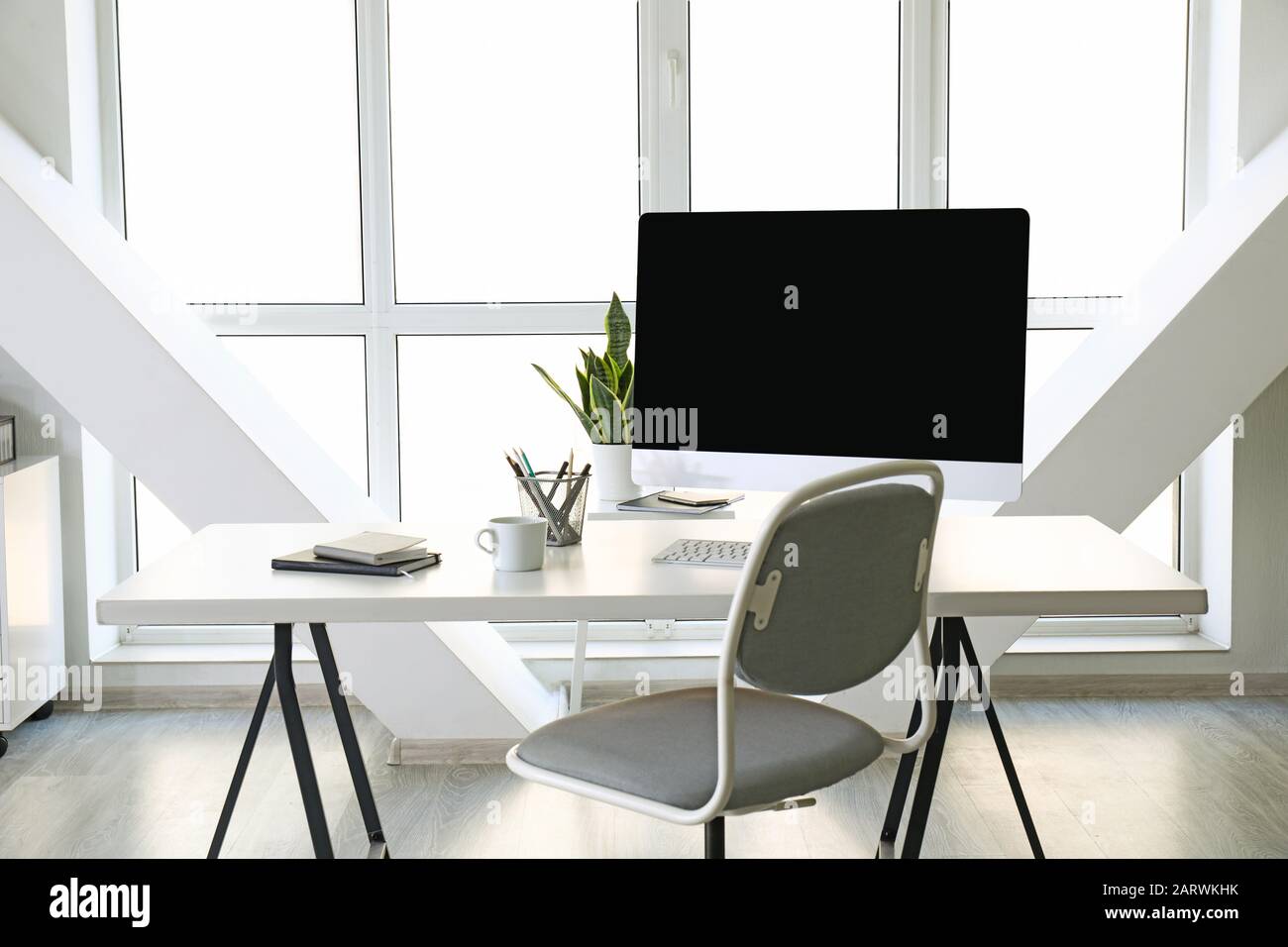 Comfortable workplace in light modern office Stock Photo - Alamy