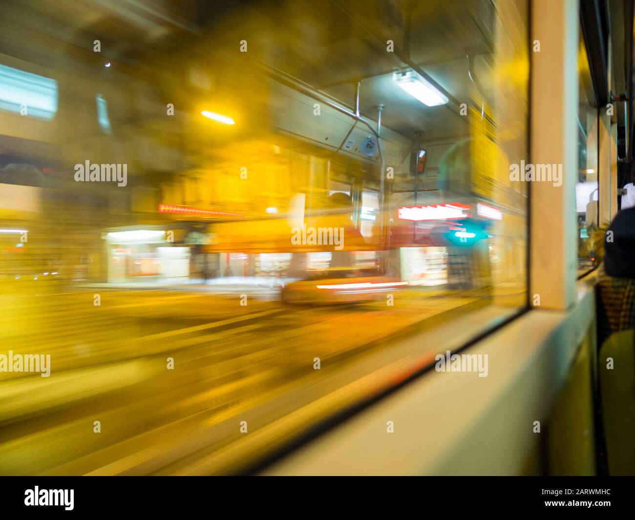 View from bus through window city town urban street motion moving ...
