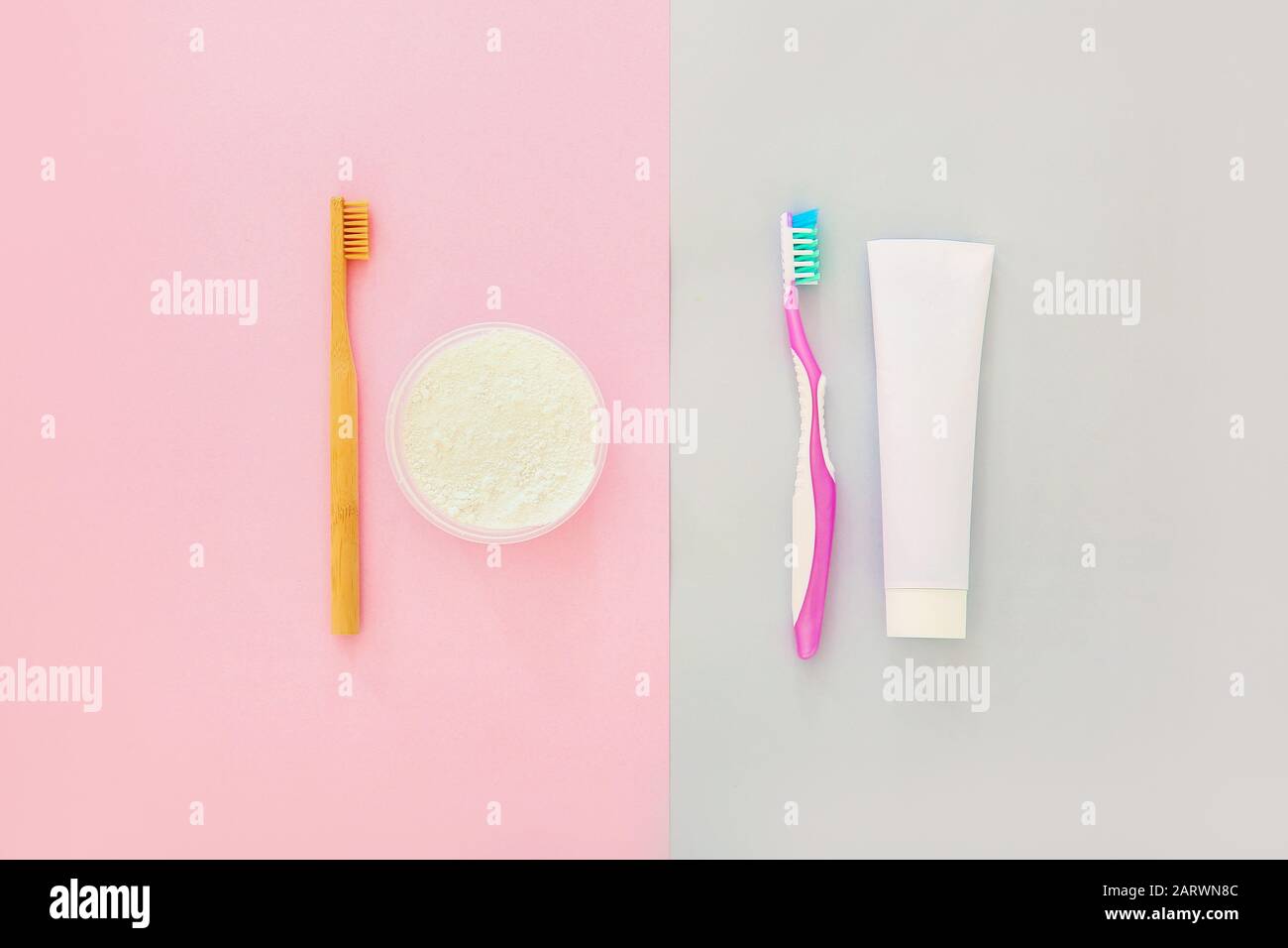 Tooth powder, brushes and paste on color background Stock Photo - Alamy