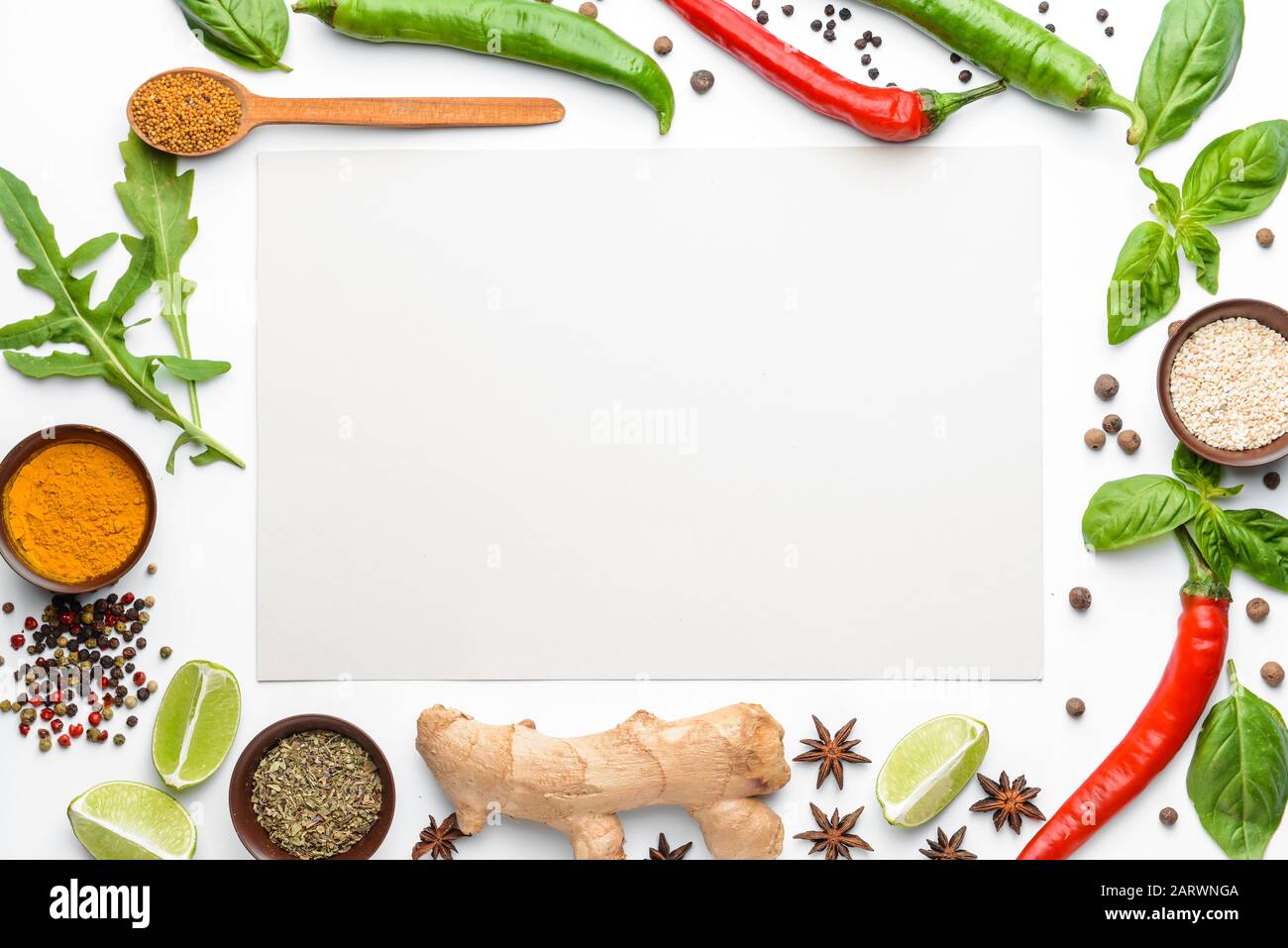 Empty paper sheet with different spices on white background Stock Photo ...