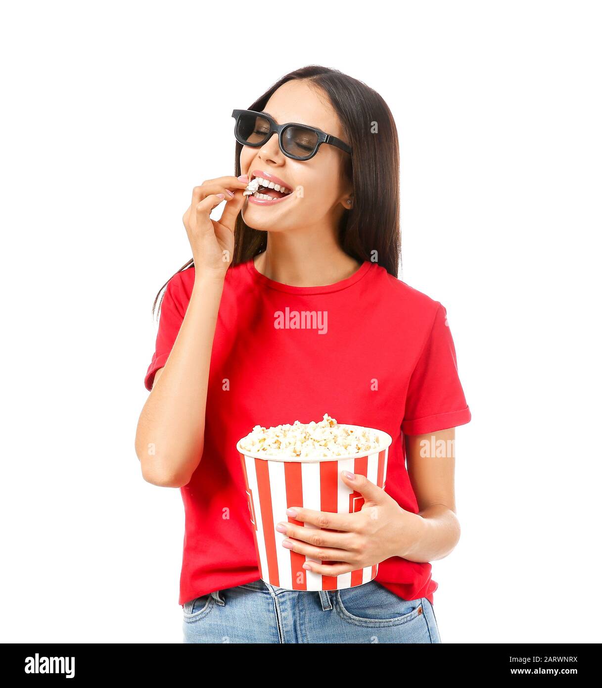 Young woman eating popcorn on white background Stock Photo - Alamy