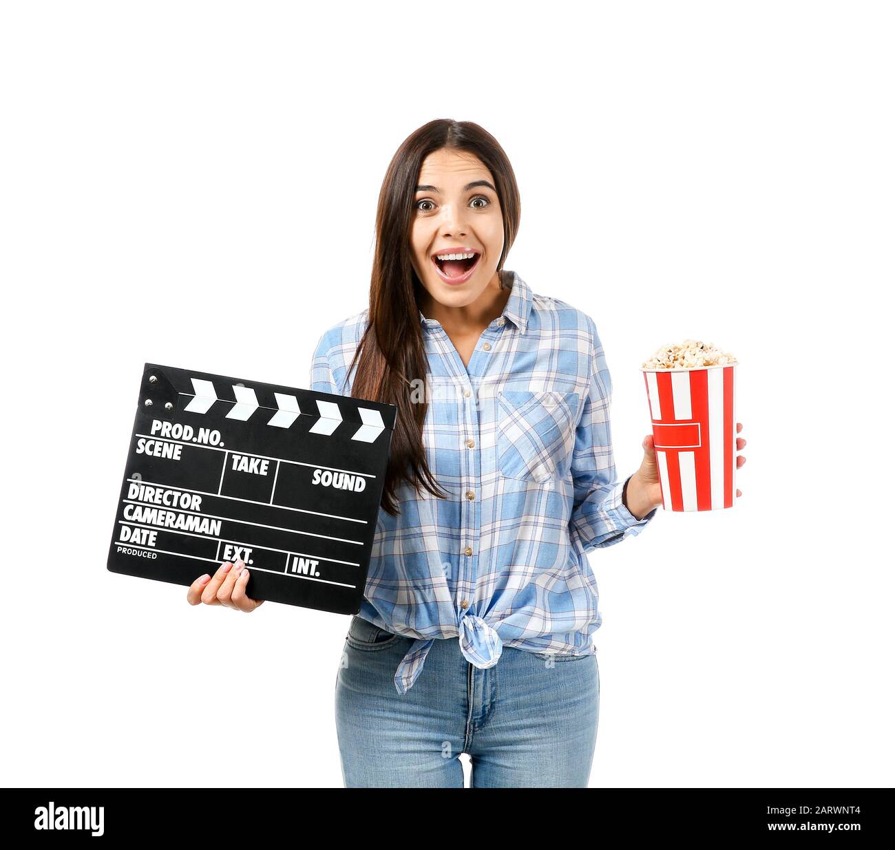 Surprised woman with popcorn and movie clapper on white background ...