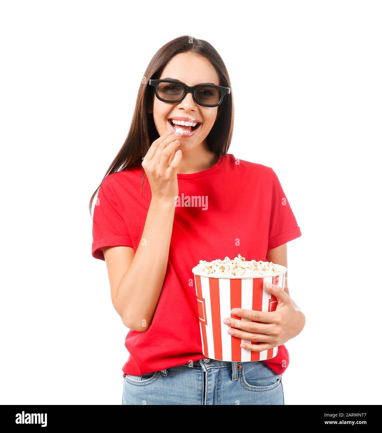 Young woman eating popcorn on white background Stock Photo - Alamy
