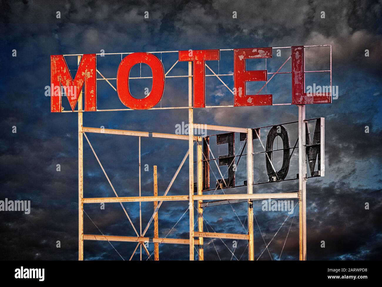 Road side old motel sign in front of beautiful sky and clouds on ...