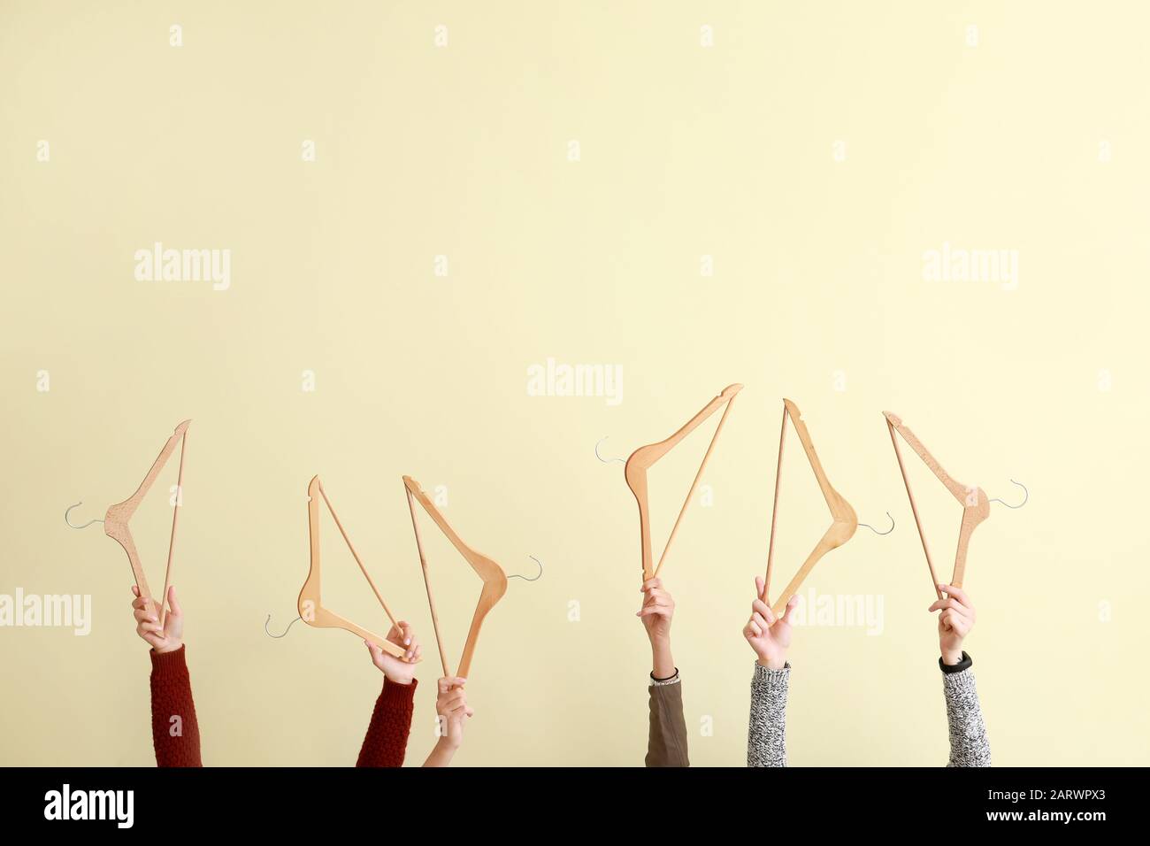 Clothing on hangers female hands hi-res stock photography and images ...
