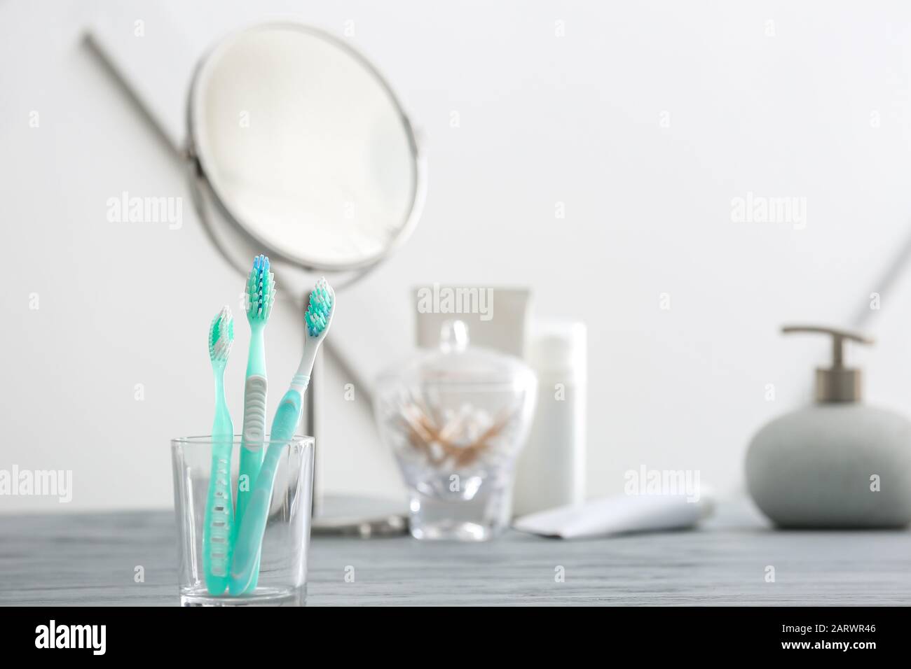 Tooth brushes in glass cup hi-res stock photography and images - Alamy