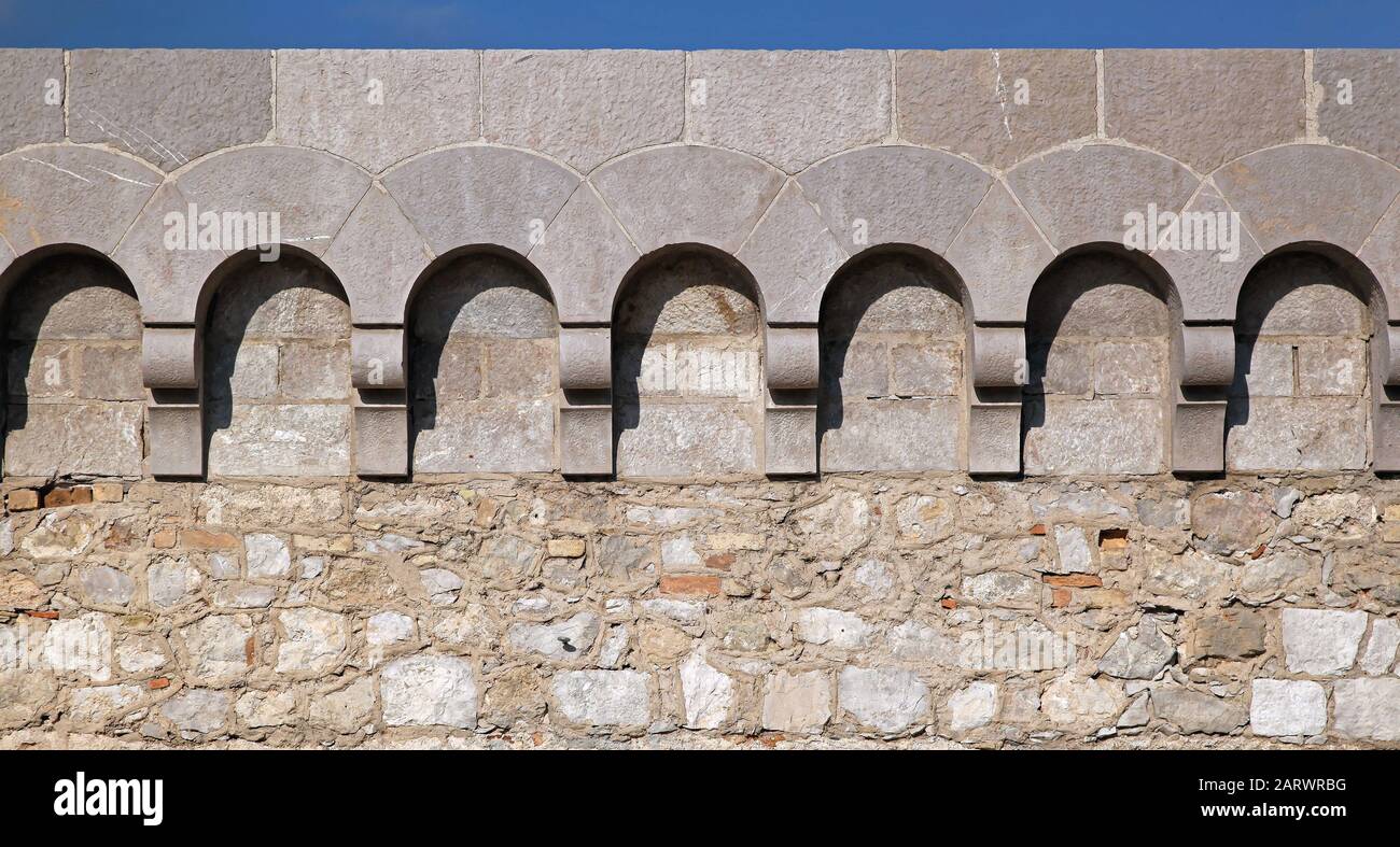 Castle fortification wall with stone arches Stock Photo - Alamy