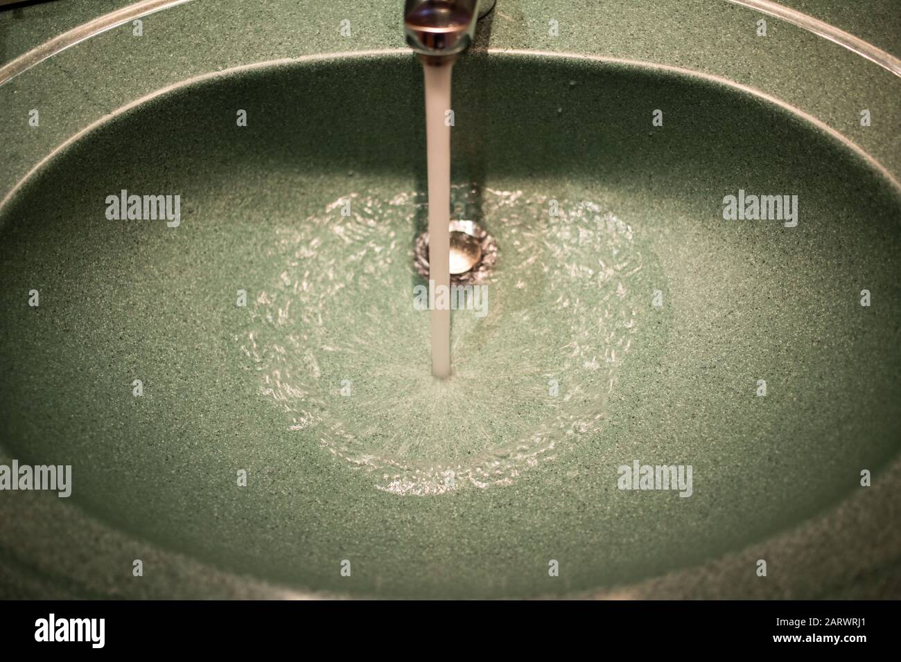 running tap water in bathroom Stock Photo - Alamy