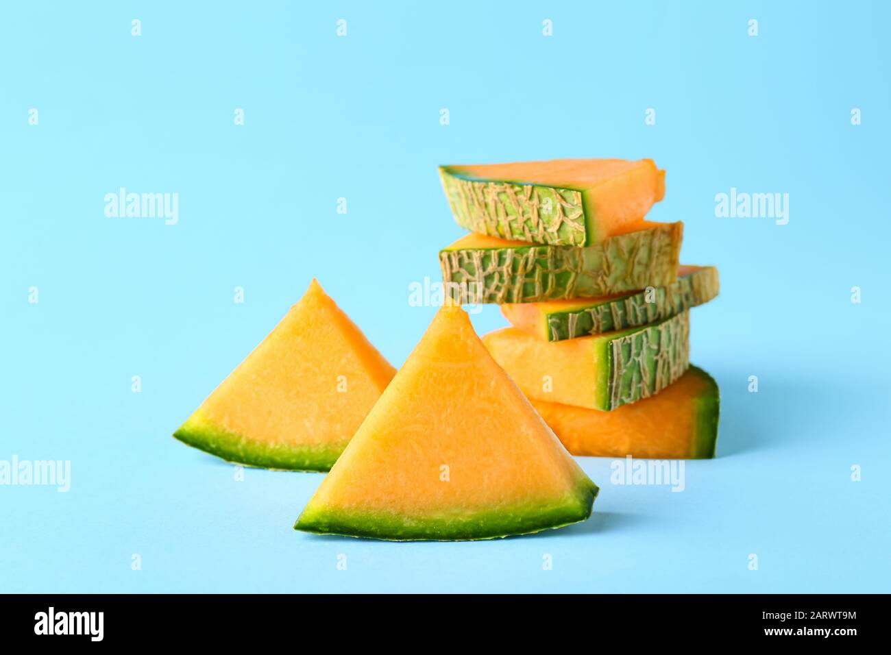 Sweet cut melon on color background Stock Photo - Alamy