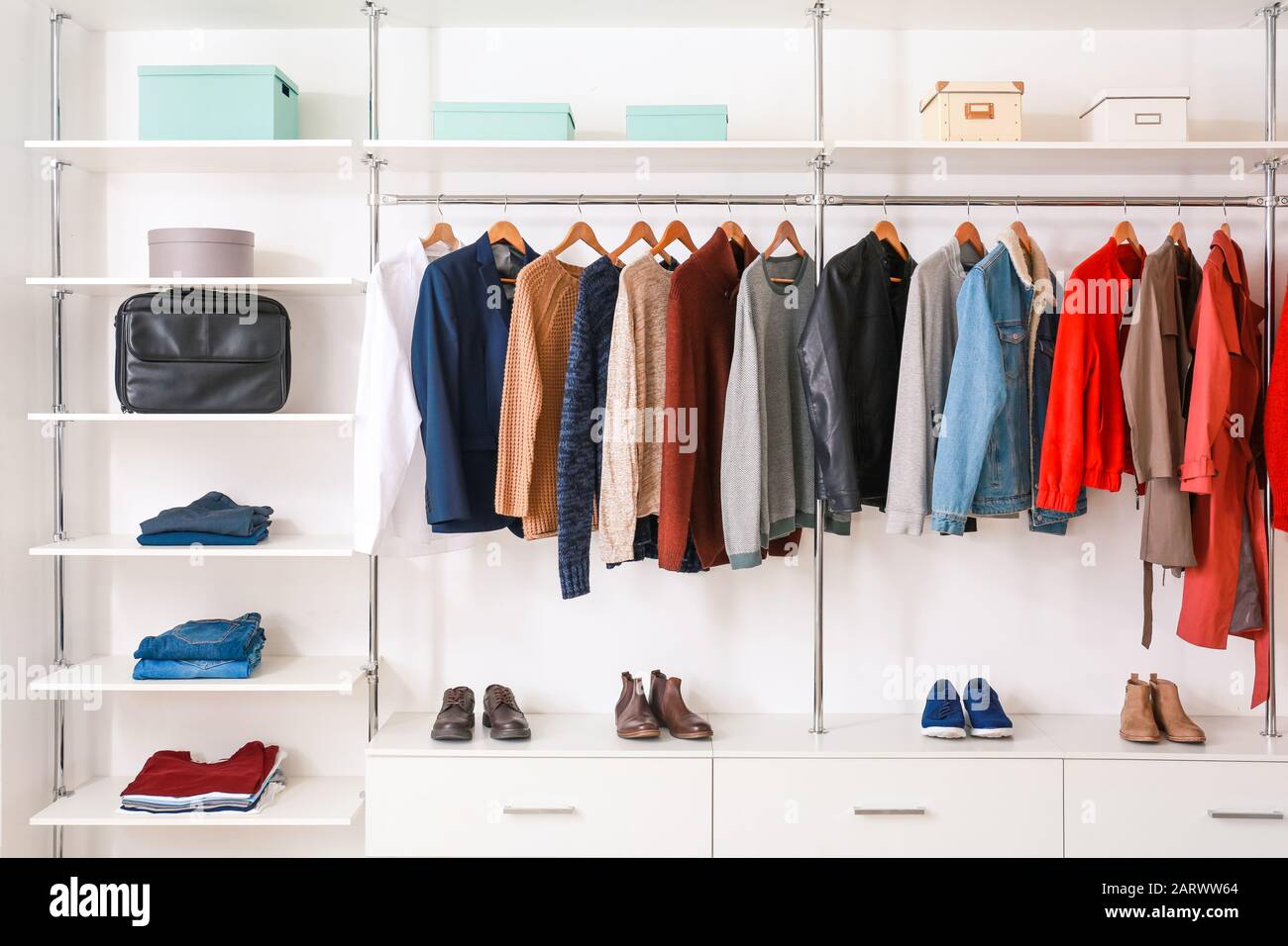 Big wardrobe with clothes in dressing room Stock Photo - Alamy