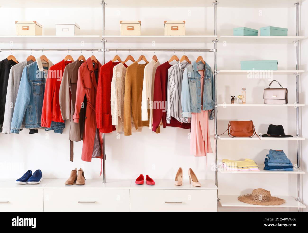 Big wardrobe with clothes in dressing room Stock Photo - Alamy