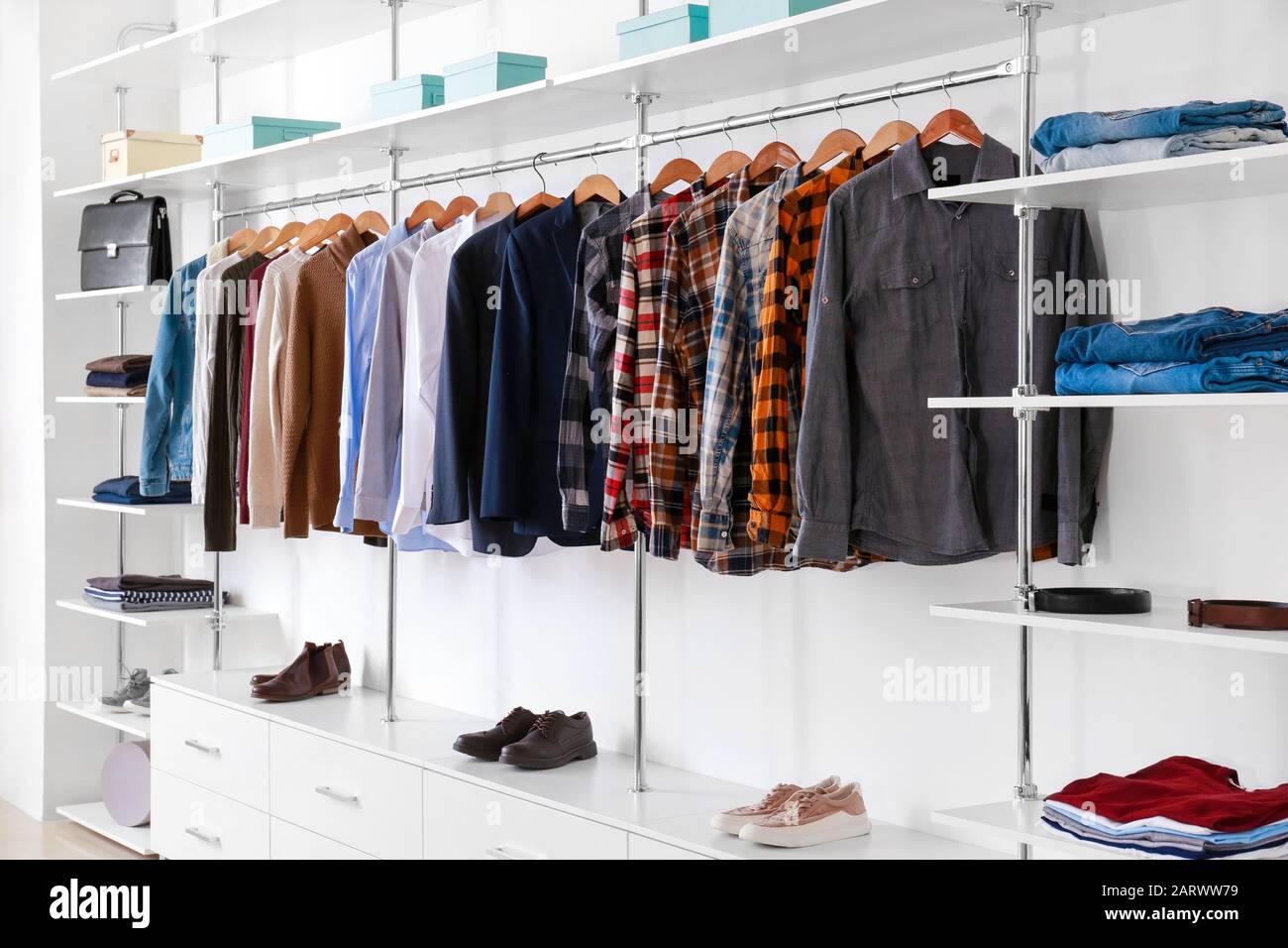 Big wardrobe with clothes in dressing room Stock Photo - Alamy