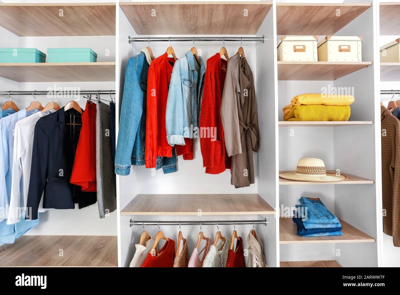 Big wardrobe with clothes in dressing room Stock Photo - Alamy