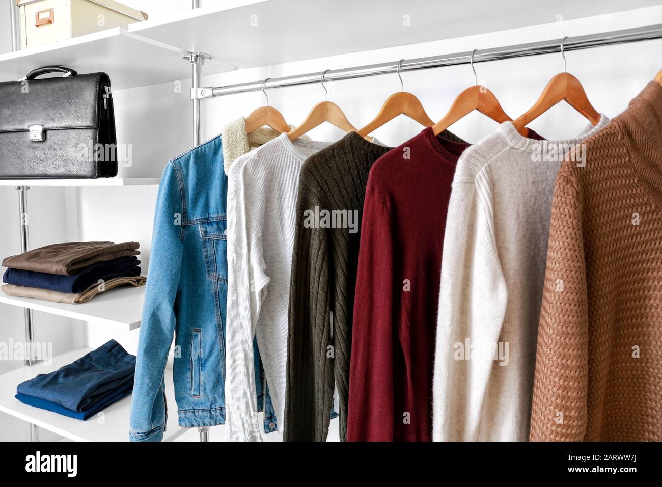 Big wardrobe with clothes in dressing room Stock Photo - Alamy